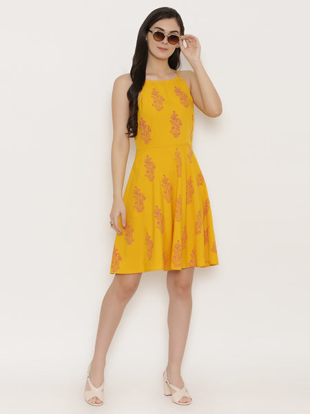 Buy Backless with string design printed skater dress in Mustard for Women